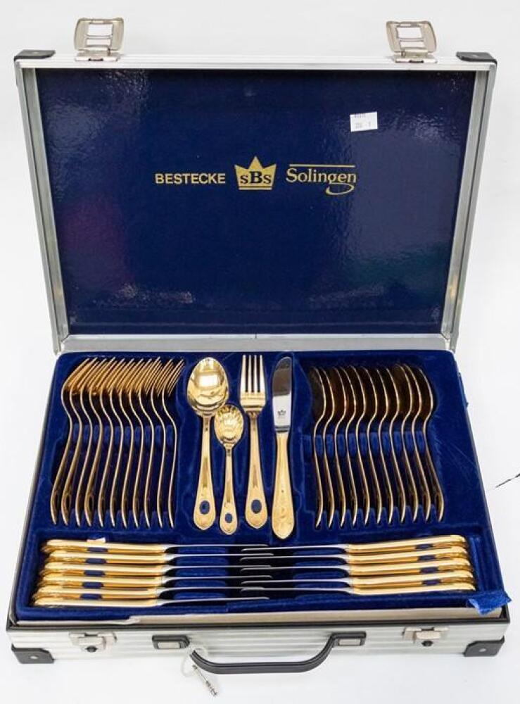 An aluminium cased, ten-piece, gold-plated Bestecke Solingen canteen of ...