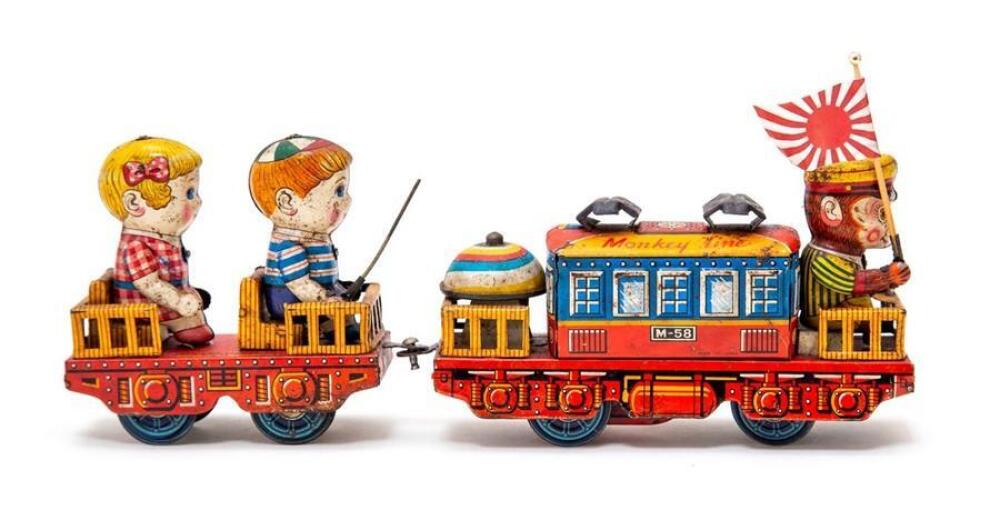 Monkey Line Train: A clockwork, tinplate, Monkey Line Train, pulling a ...