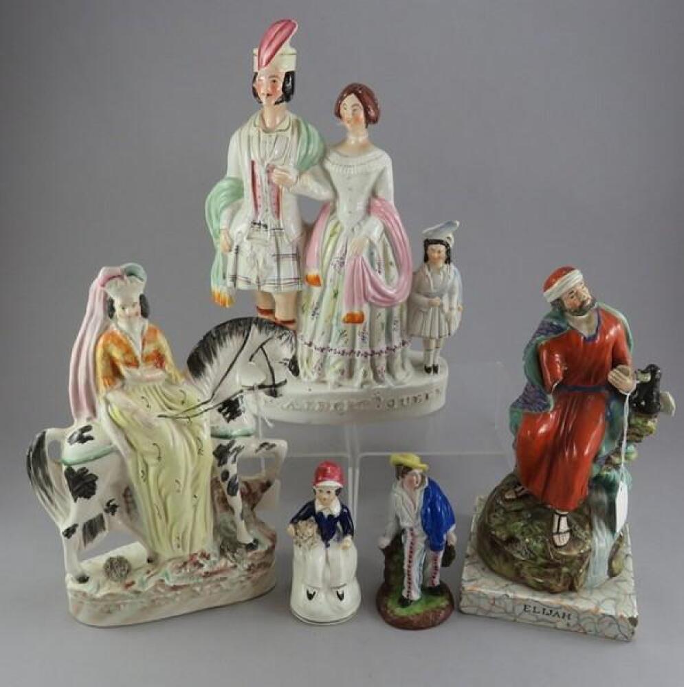 A group of Staffordshire figures to include Queen Mary, Albert and the ...