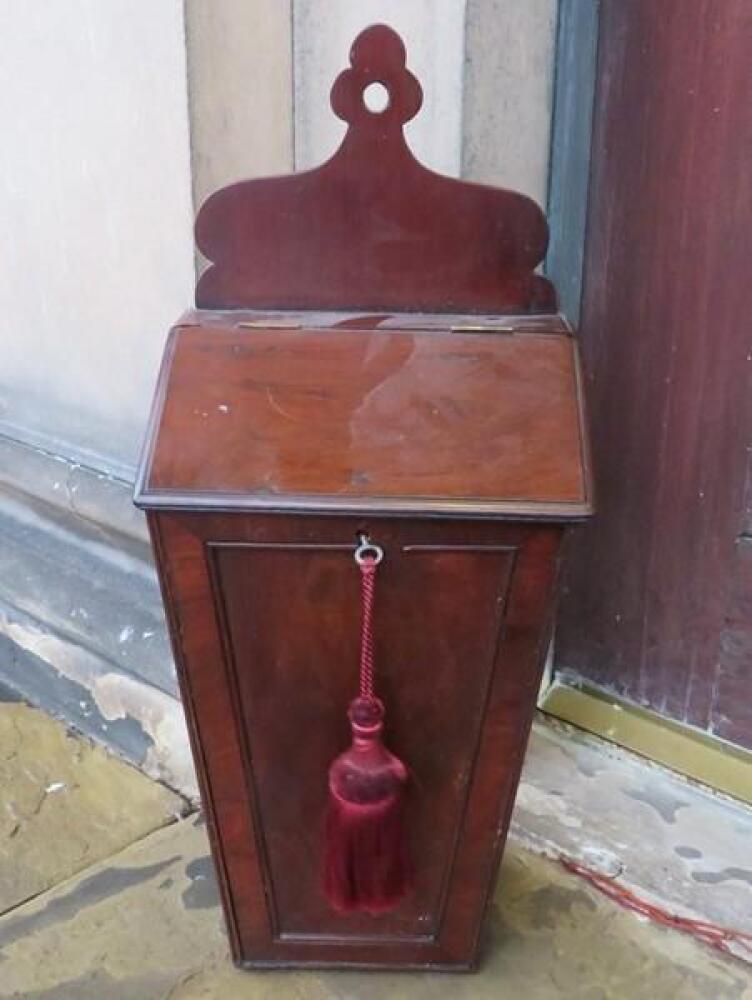 A mid-nineteenth century mahogany hanging candle box of tapered coffin ...