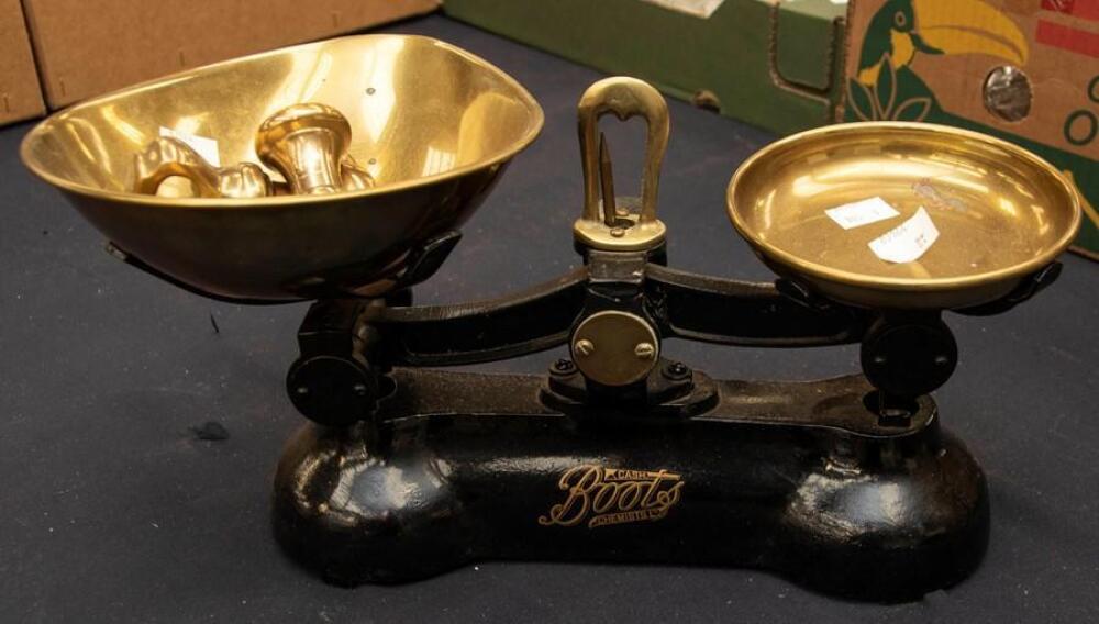 A set of boots cast weighing scales