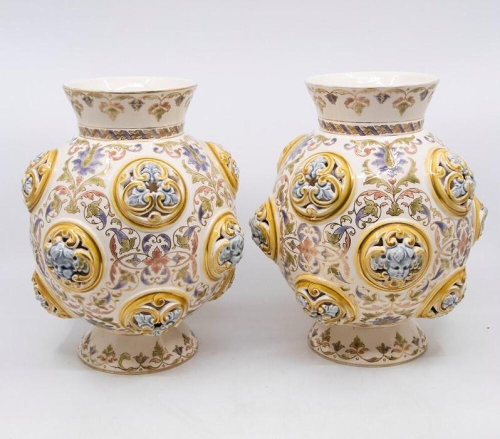 A pair of Continental Faience style china vases, circular with flared ...