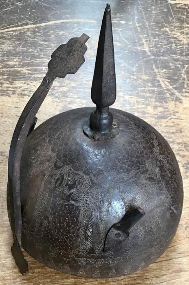Heavily engraved Eastern metal helmet and spear head