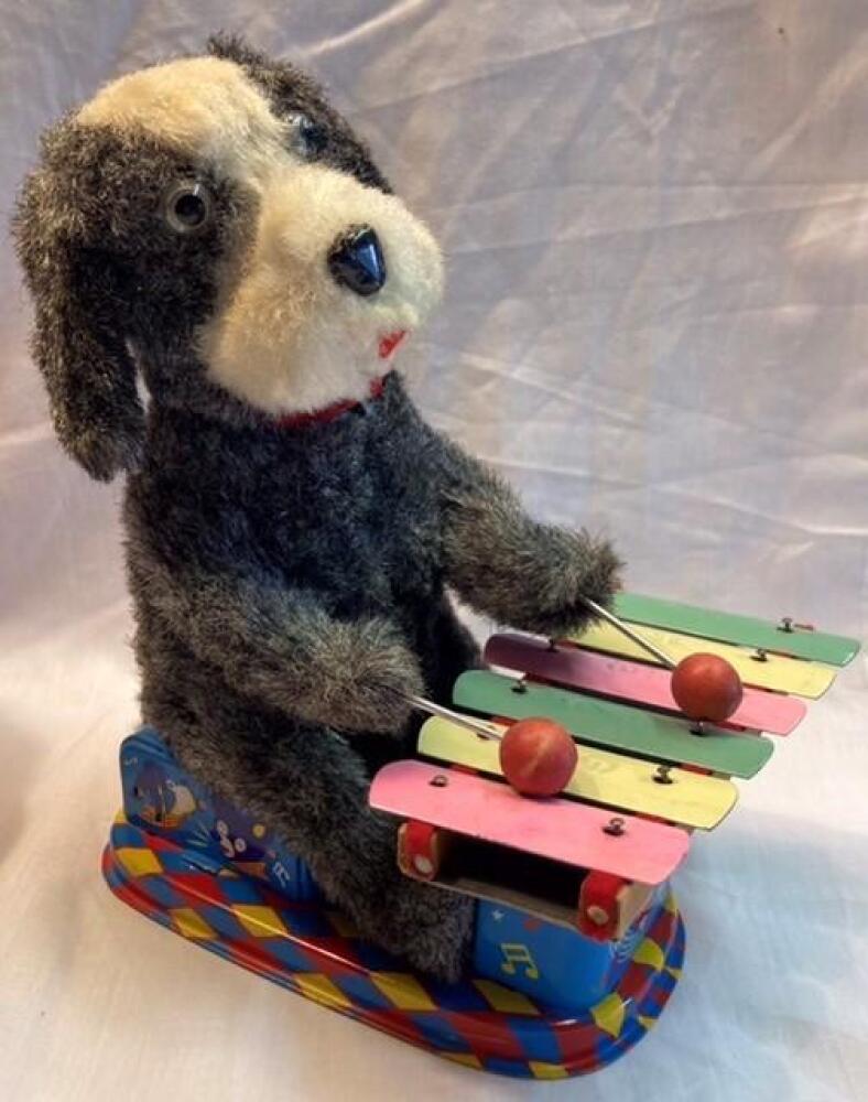 Tinplate: A vintage battery operated, Xylophone Dog, in working ...