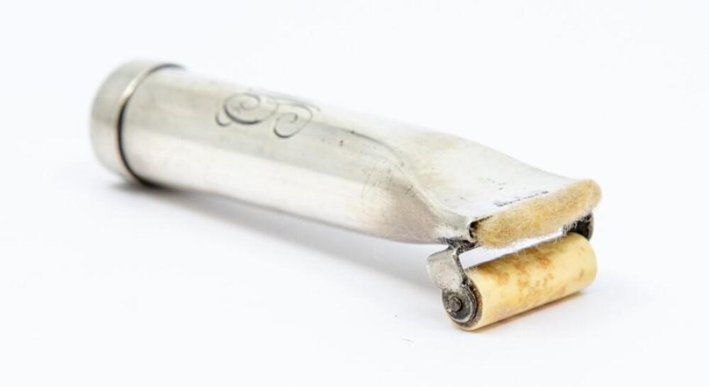 An Edwardian novelty silver stamp moistener and applicator in the form ...