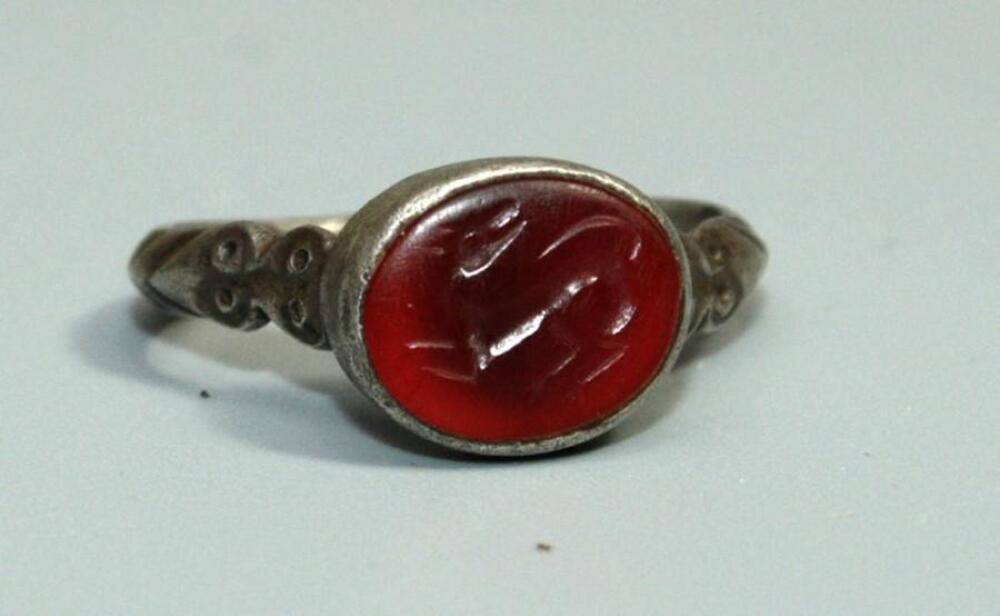 A Greek style silver and carnelian Ring with oval bezel set carnelian ...