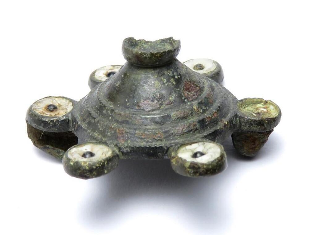 Roman tutulus disc brooch. The brooch has a conical centre and six ...