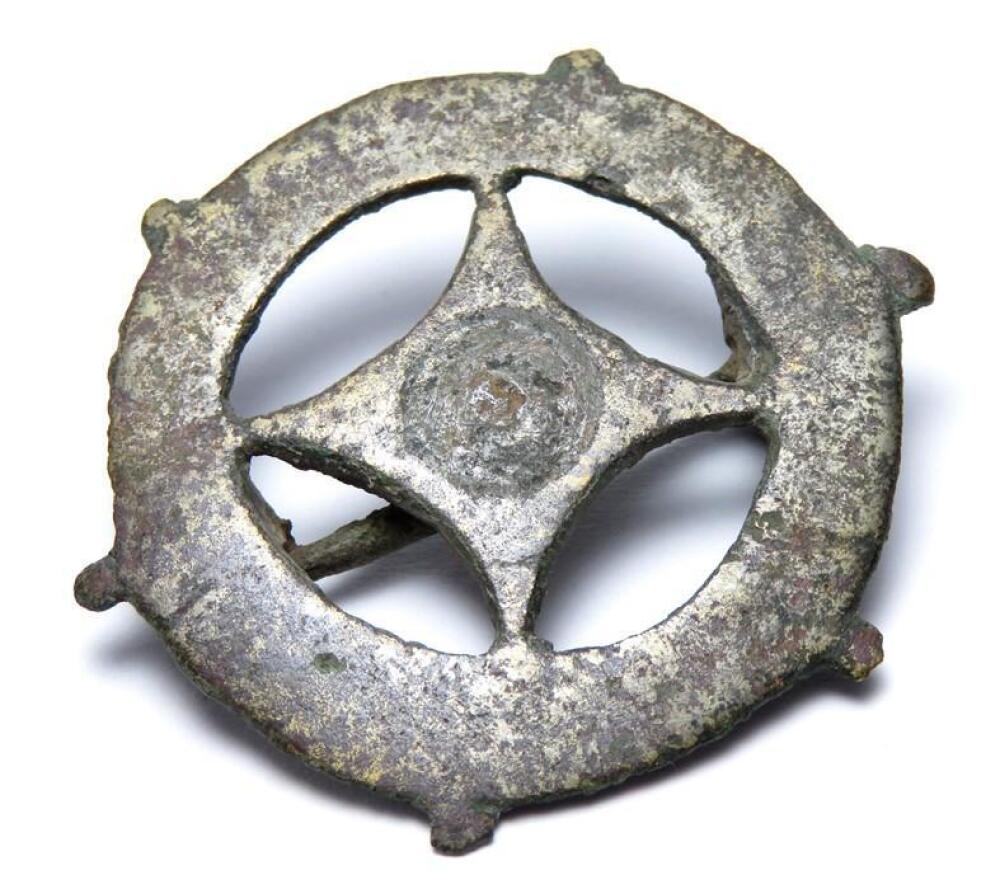 Roman openwork disc brooch with pin. A circular openwork disc brooch ...