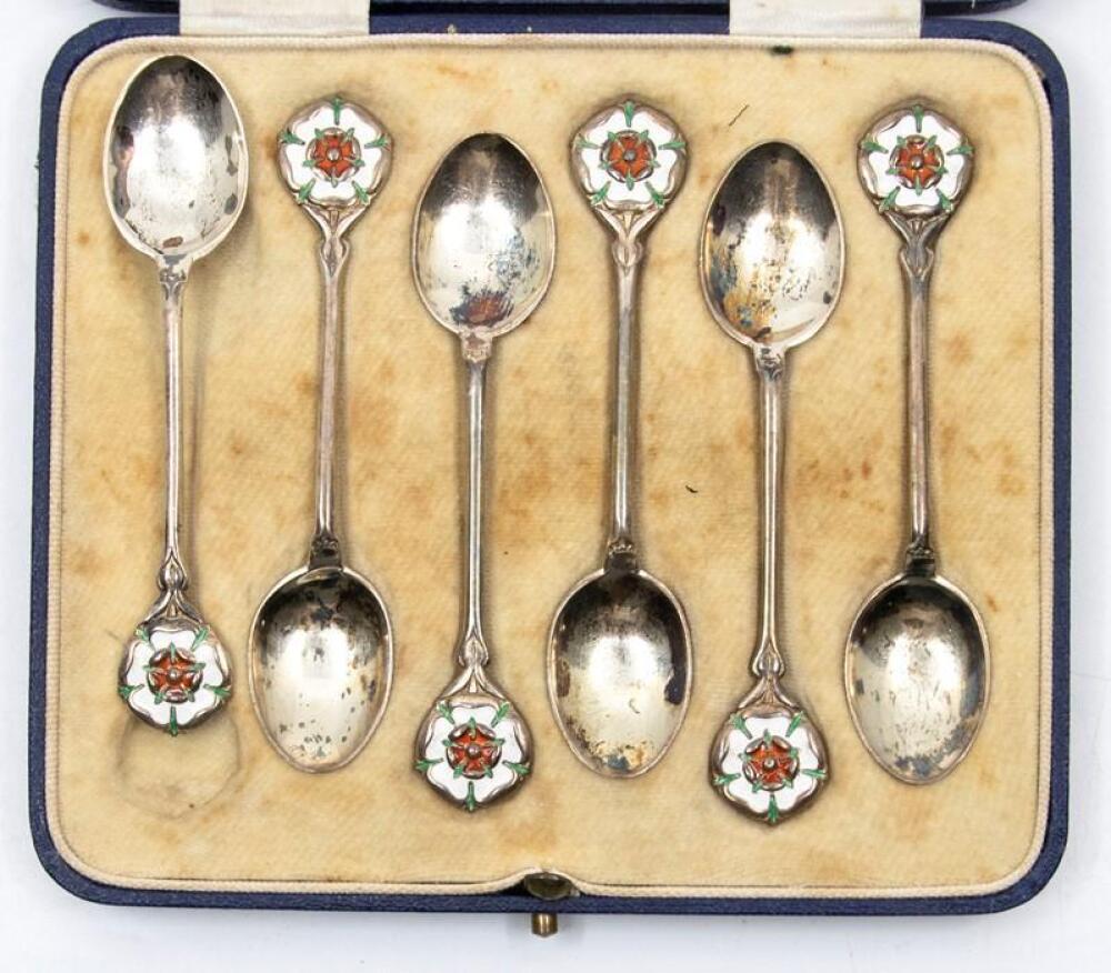 A set of six cased George V silver and enamel tea spoons, enamelled ...