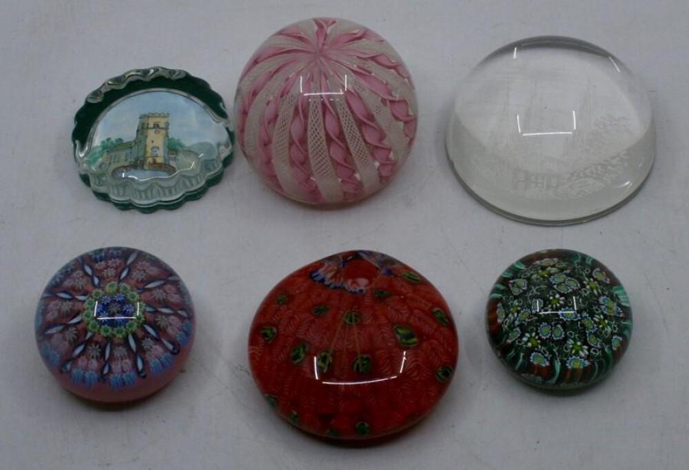 Six glass paperweights, four with millifiori design, two with images of ...