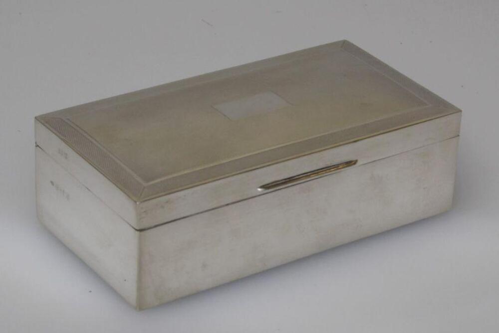 John Rose, a silver cigarette box, the rectangular engine turned cover ...
