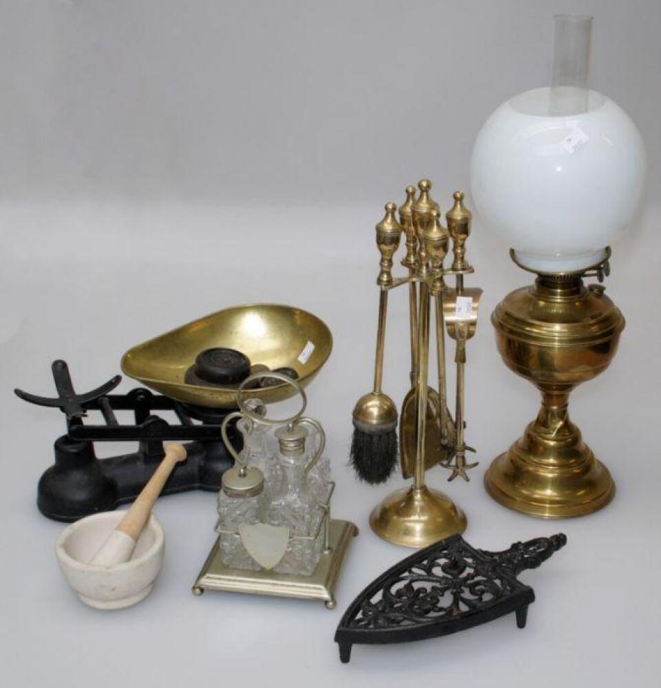 A mixed lot of collectors items including brass paraffin lamp, cast ...