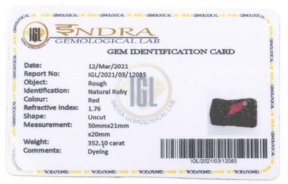 A piece of dyed rough ruby, weight approx 352.10carats, length approx ...