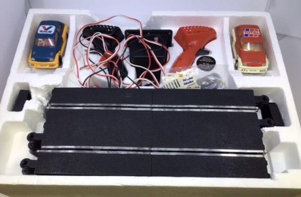 Scalextric: A boxed Mighty Metro Set with extra track, together with ...