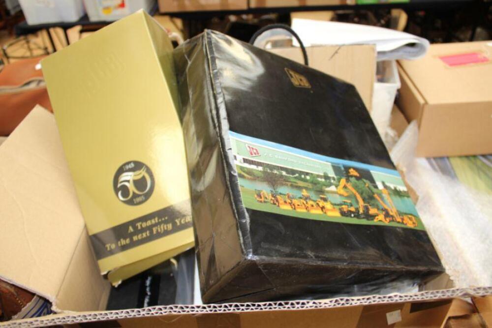 A collection of JCB memorabilia to include; magazines, catalogues, Moet ...