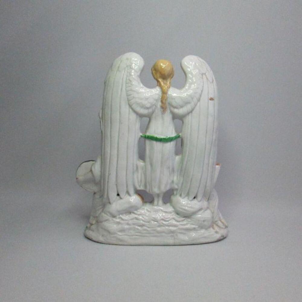 A rare Staffordshire figure of a group with Angel ‘Peace’ Pugh B figure ...