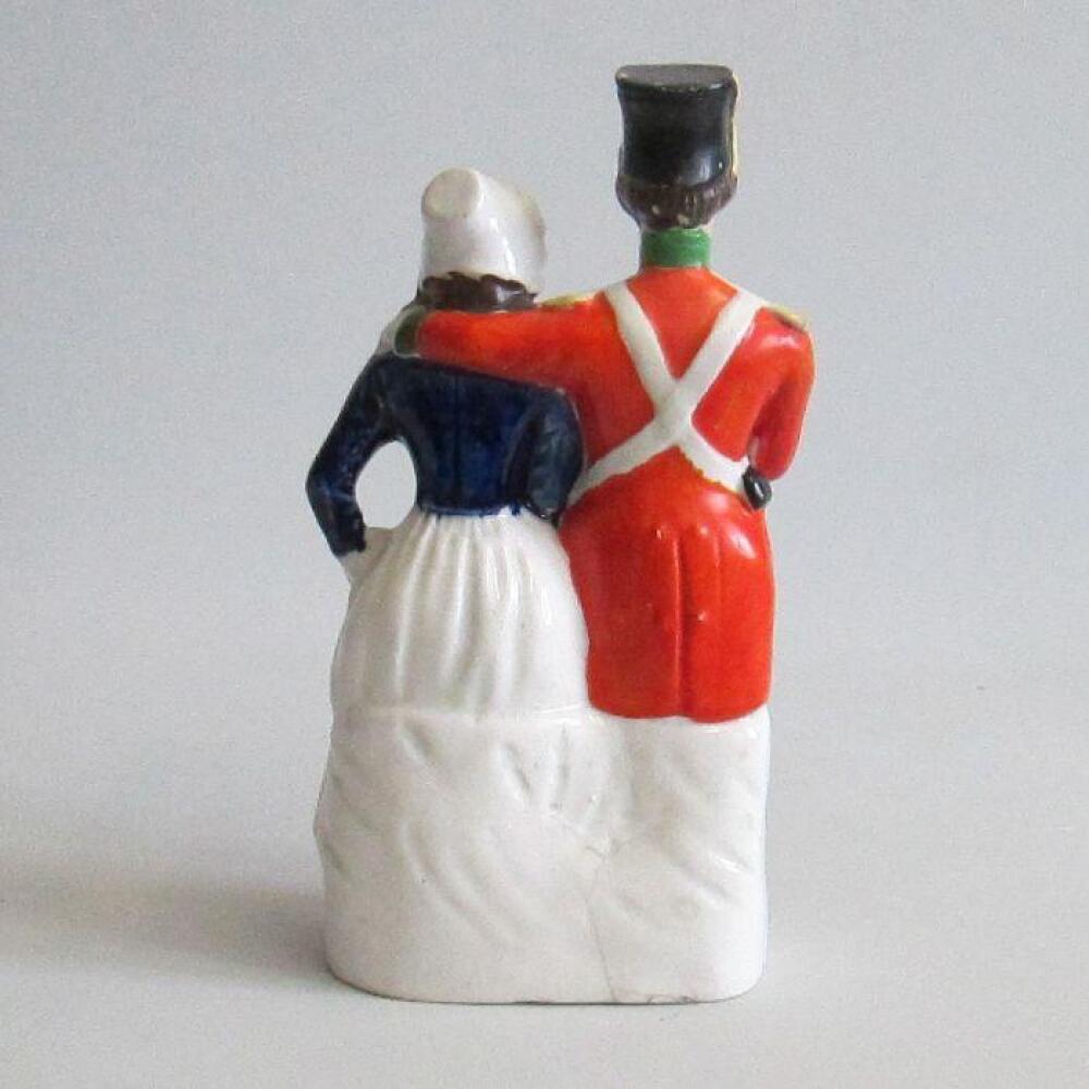 A Staffordshire figure of solider with his lady. Alpha factory Pugh C ...