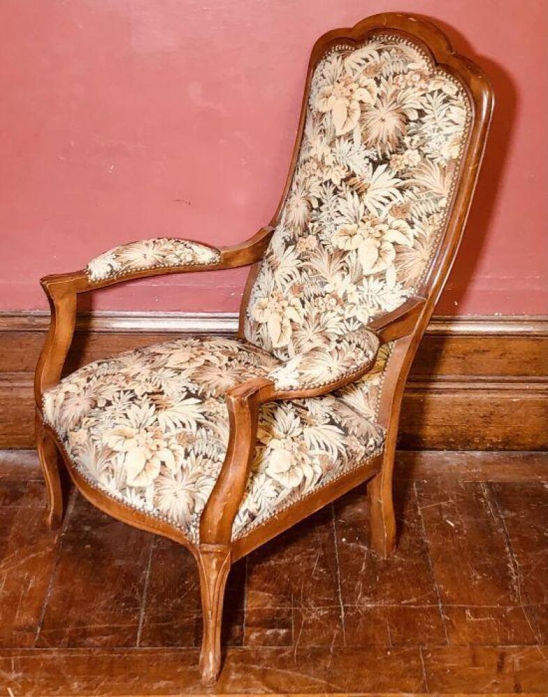 A 19th century walnut high back nursing arm chair, camel top back rest ...