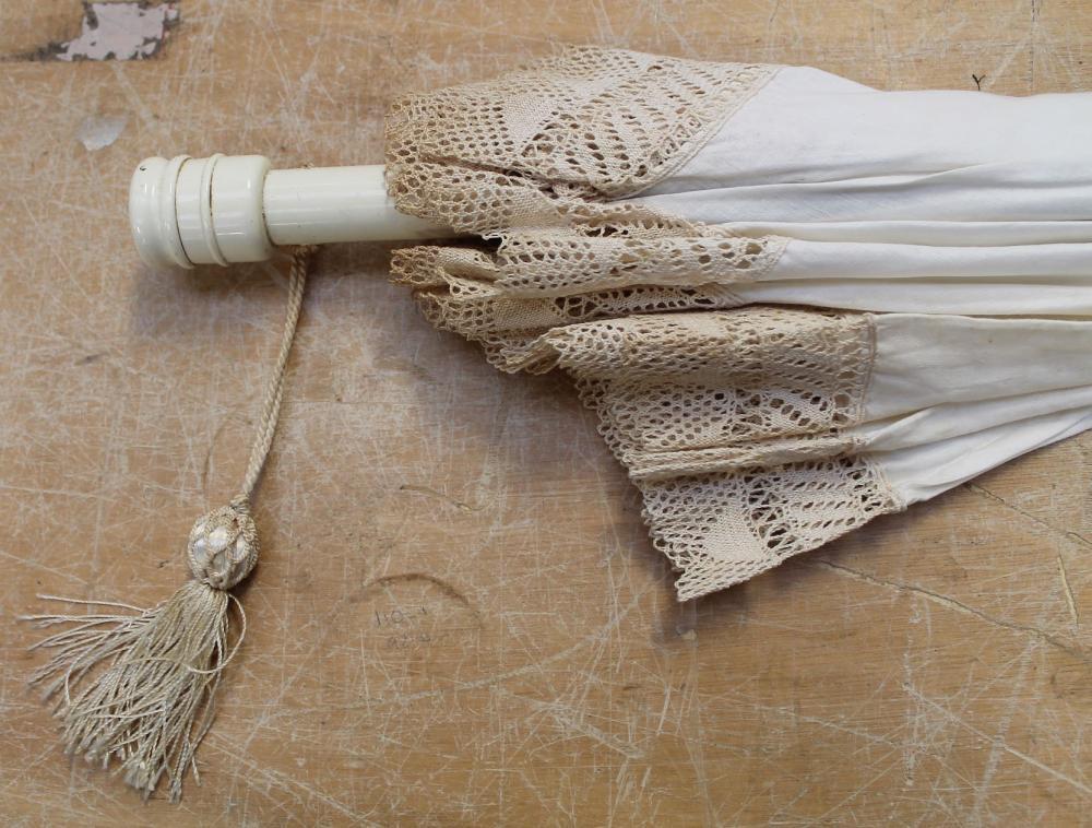 Parasols – One with a cane handle, cream cotton cover which is ...