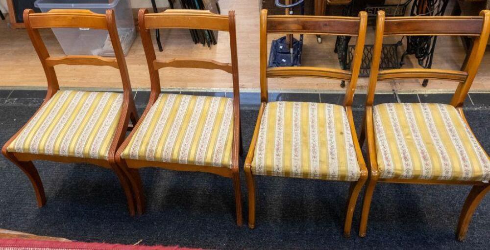 A reproduction pull-out pedestal table with six matching chairs and one ...