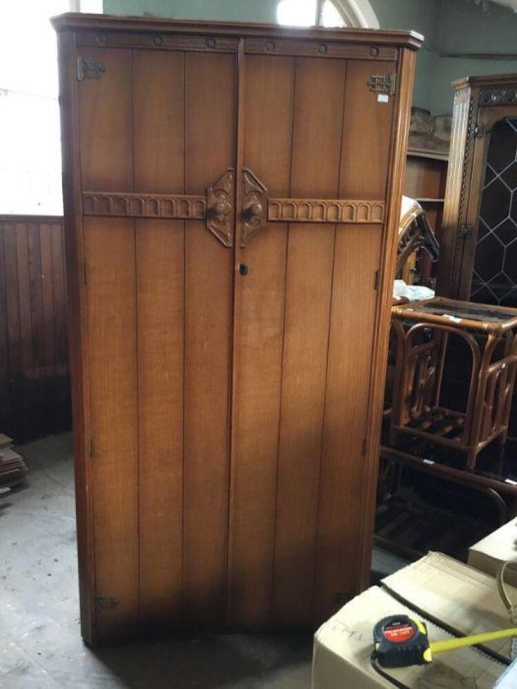 Two Austinsuite wardrobes both in honey oak with carved frieze leading ...