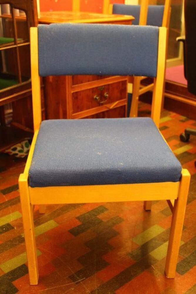 A good set of three blue fabric modern stacking chairs