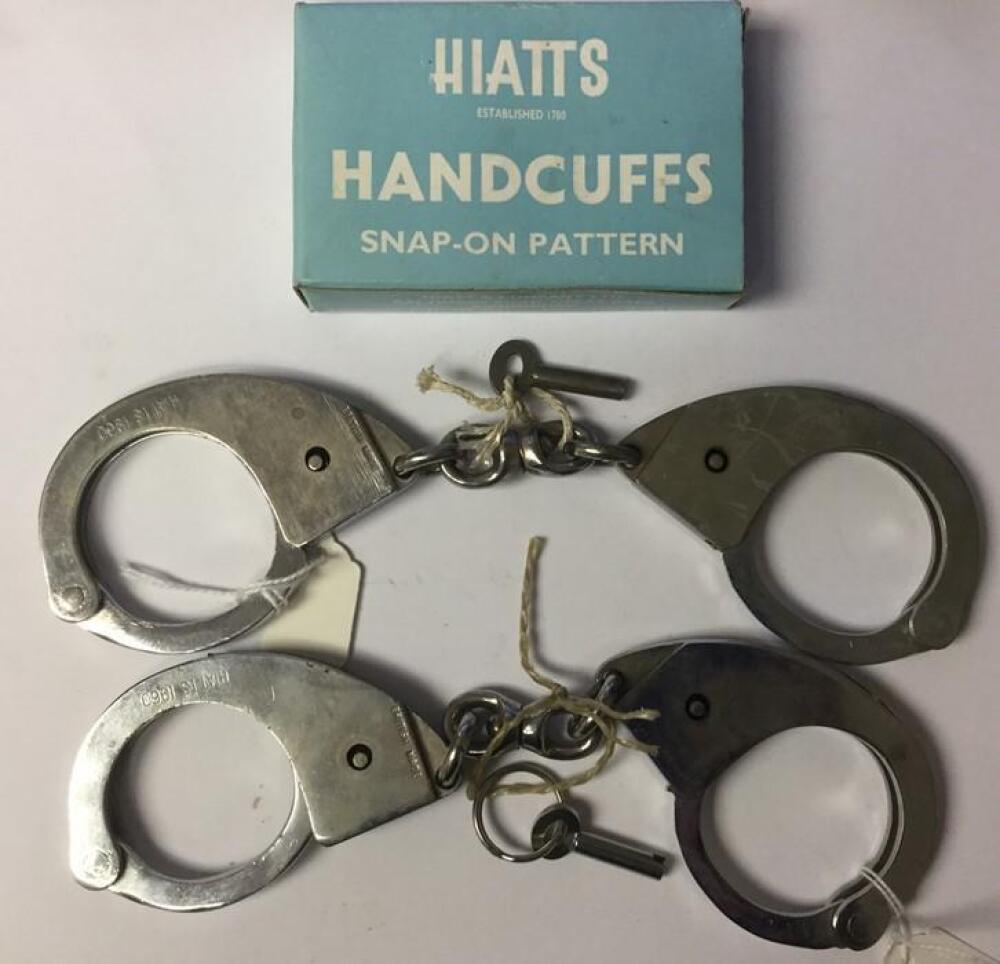 Two pairs of Hiatt's 1960 Pattern handcuffs. One in original box, both ...