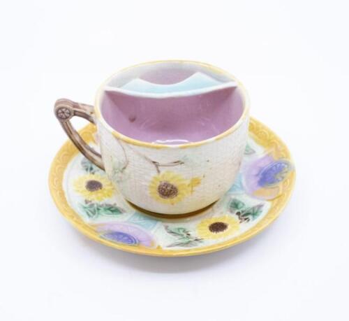 A Samuel Lear Minton majolica moustache cup and saucer, basket weaved ...