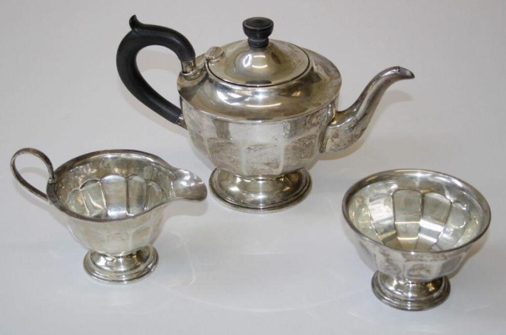Edward Viner, a silver teapot of panel form with ebonized fittings ...