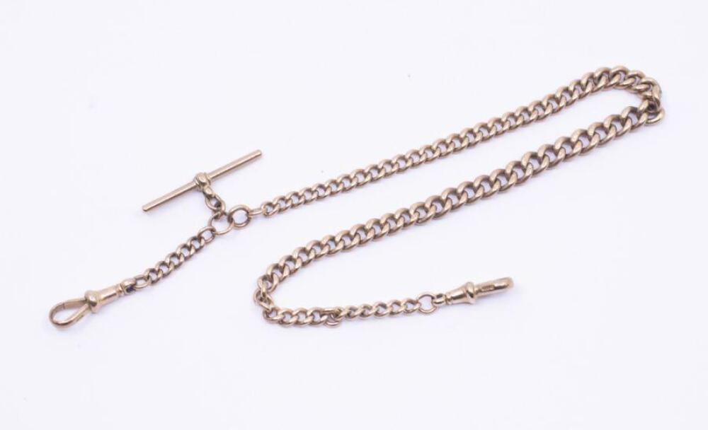 A 9ct rose gold graduated Albert link chain with two swivel clasp and T ...