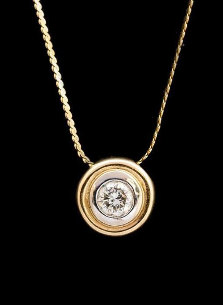A diamond solitaire 14ct yellow gold pendant and chain, the small ...