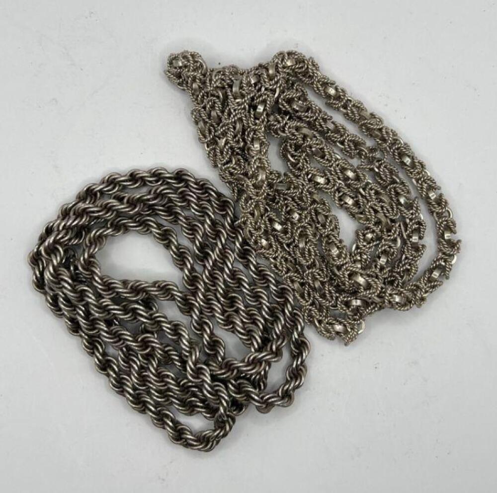 A pair of white metal chains, one a rope chain, measuring approximately ...