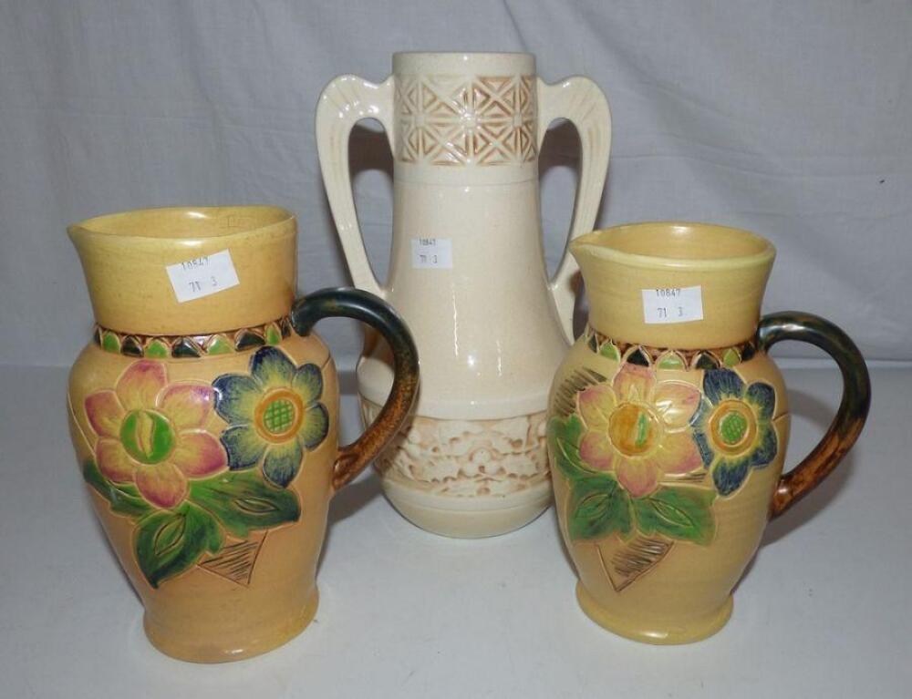 Two Bretby Art pottery jugs with incised decoration of passion flowers ...
