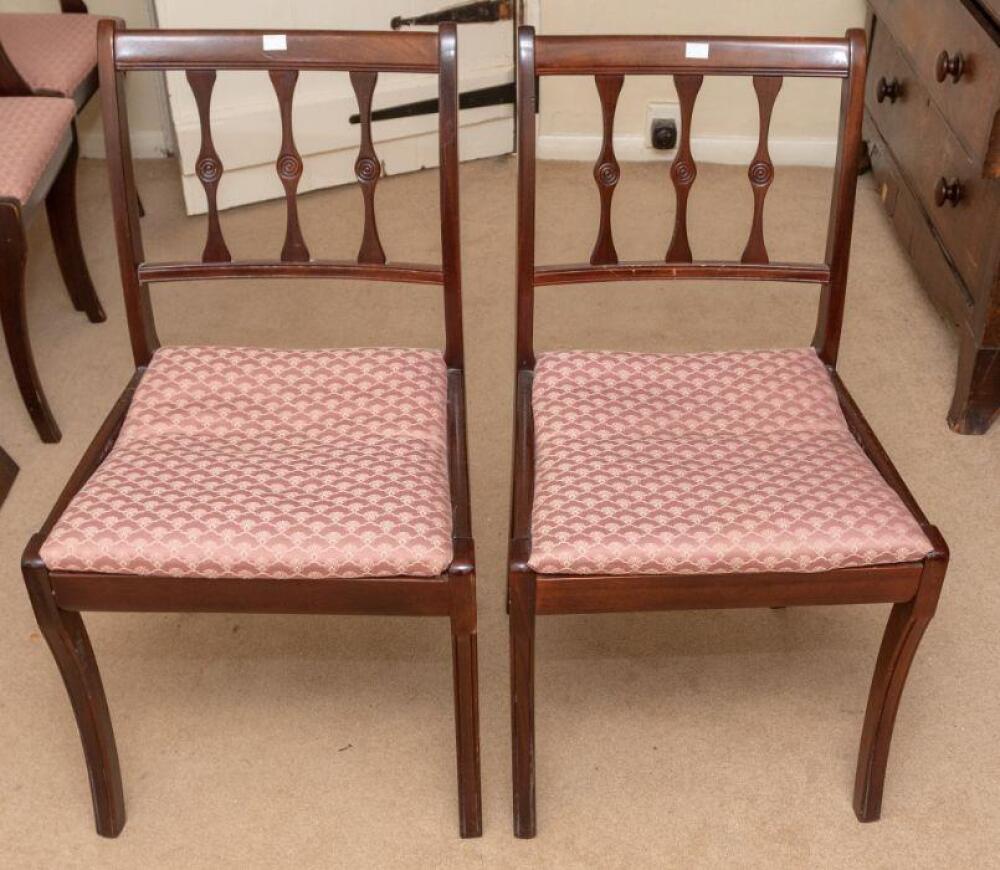 A Regency reproduction mahogany dining table and four chairs.