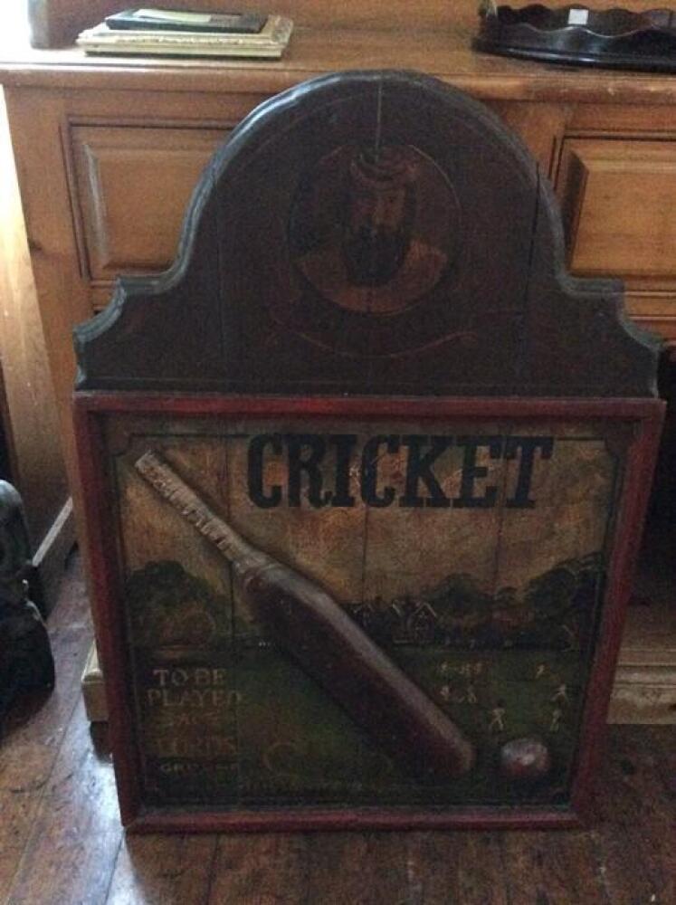 A 20th Century Cricket bar advertising board, inset with a model of ...
