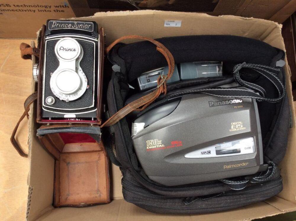 A Panasonic handheld video camera, with a 1950's vintage Prince Junior ...
