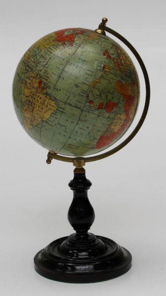 a Philips six inch terrestrial globe. Label named Pollock and Stewart, Glasgow. On baluster ...