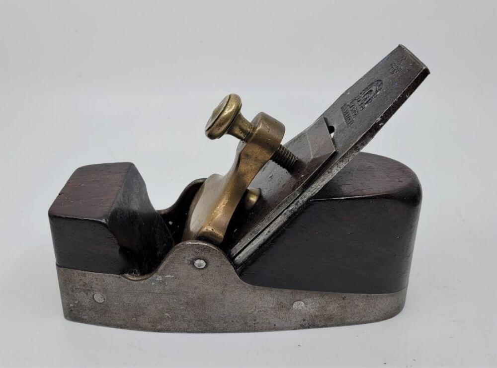 A steel smooth plane, with rosewood infill and Ward iron, sole 7 1/16in ...