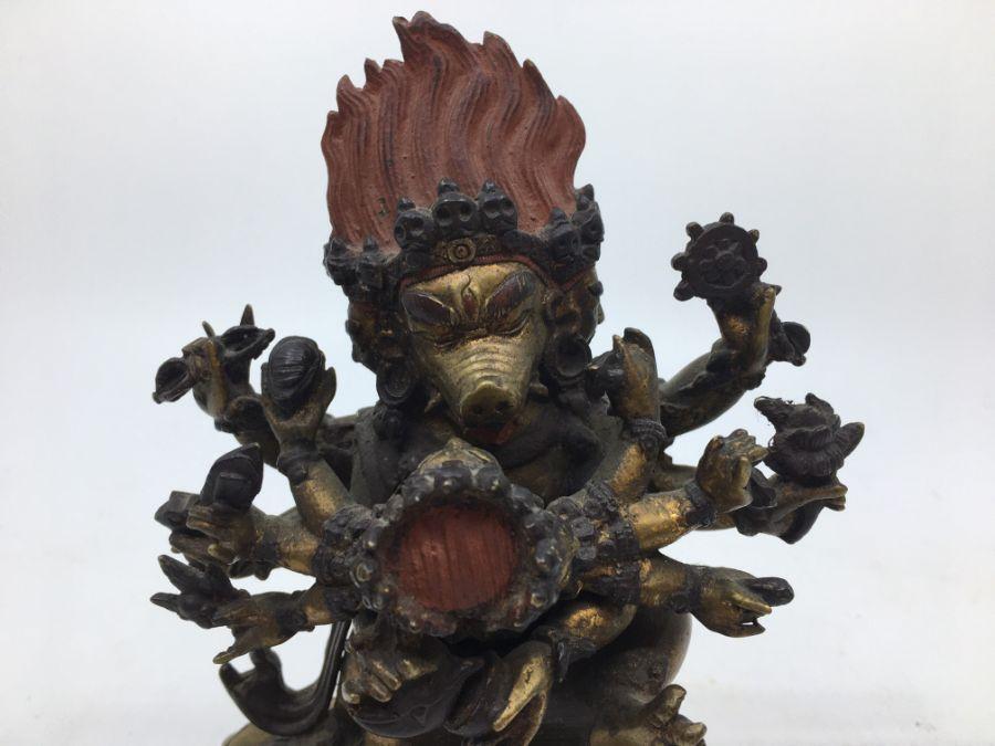 A 20th century Chinese gilt metal and polychrome paited figure of deity ...