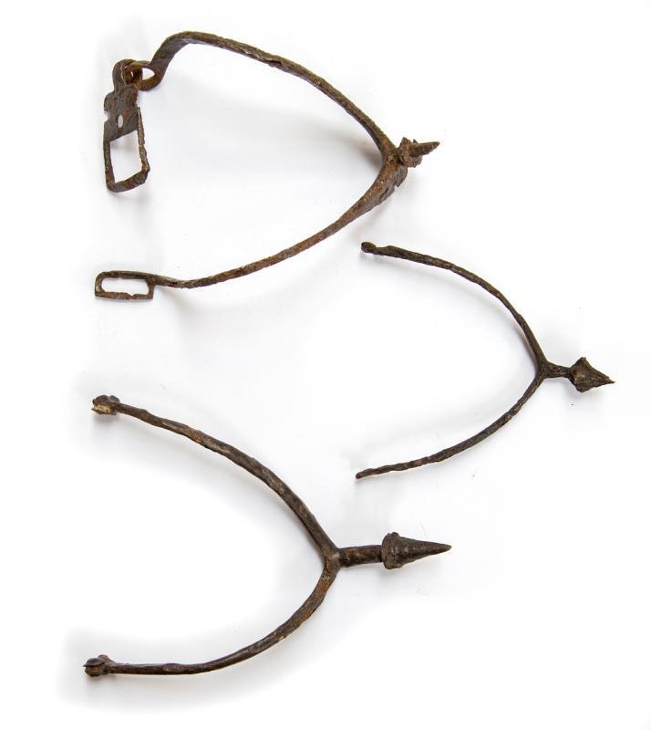 A lot of three iron prick spurs probably dating to the later Medieval ...