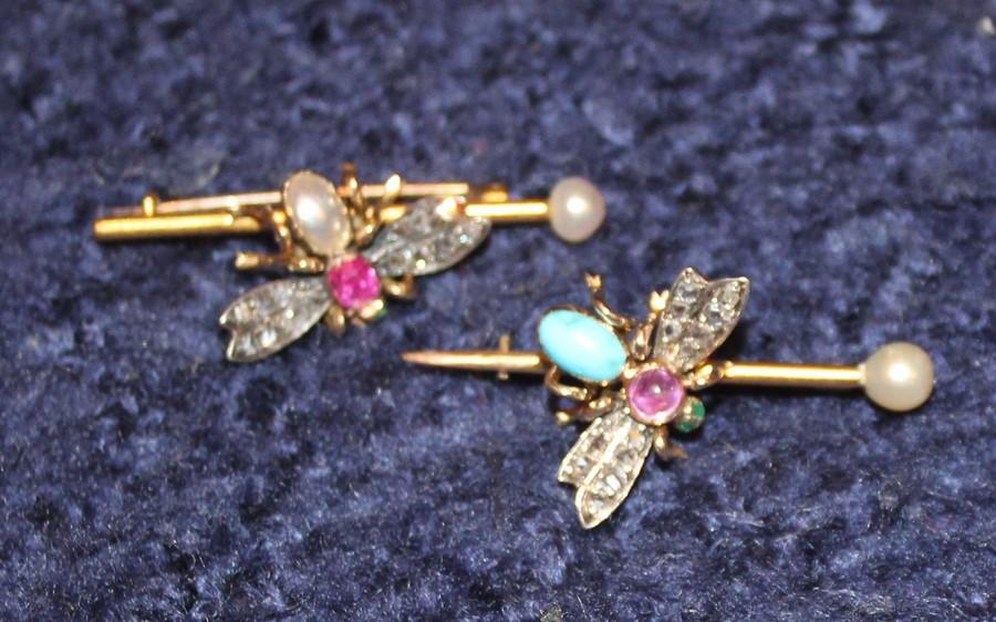 Two precious metal and gem stone set bee bar brooches, one set oval ...