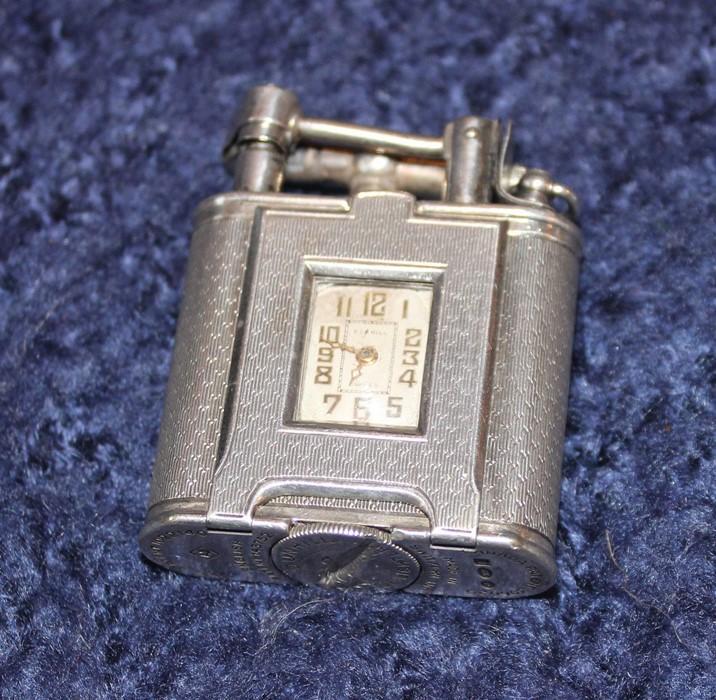 An Art Deco Alfred Dunhill & Sons Unique silver lift arm table ...