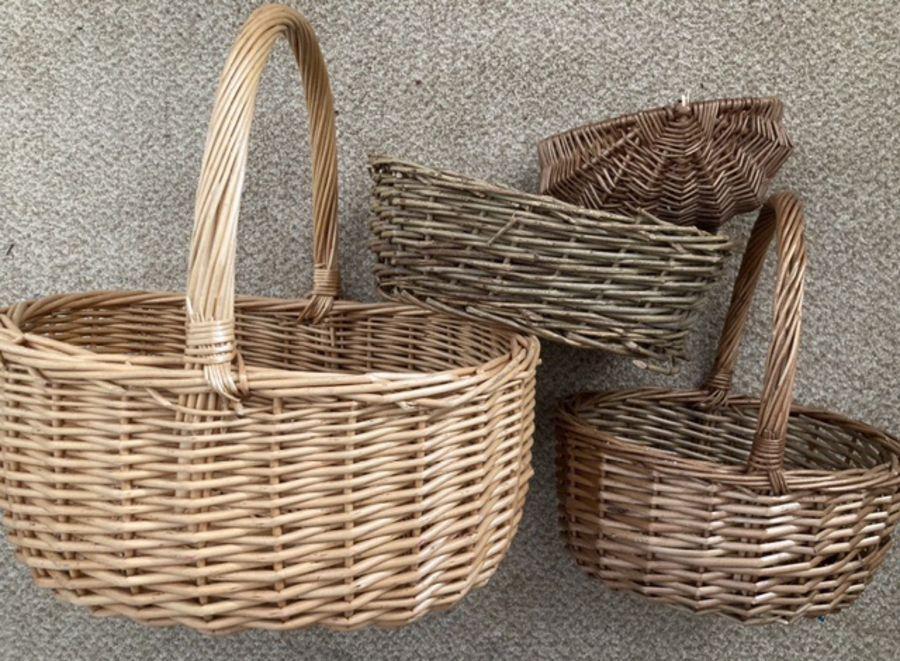 Four assorted wicker baskets.