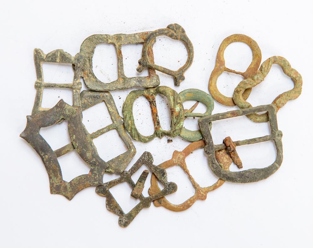 Twelve copper-alloy buckles, most double-looped examples from the 16th ...