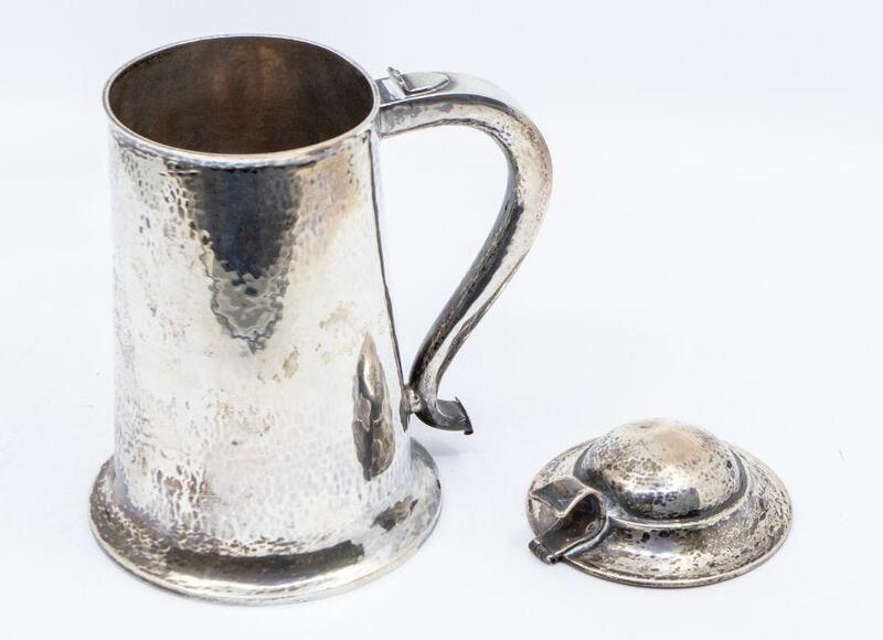 An Arts & Crafts silver tapering tankard and cover, planished ...