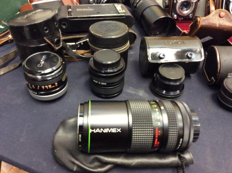 A collection of mid 20th Century cameras with cases by Yashica, Kodak ...