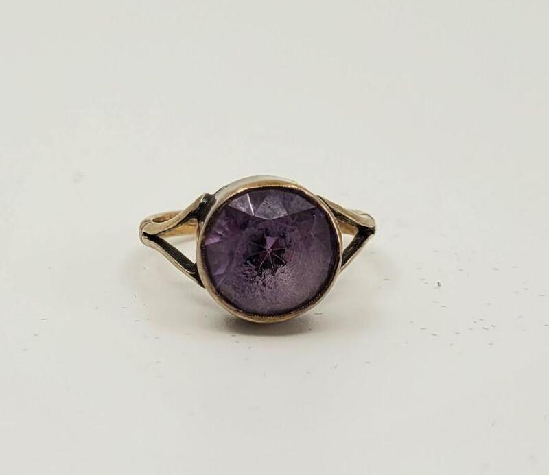 A 9ct. gold and sapphire ring, having mixed round cut sapphire in rub ...
