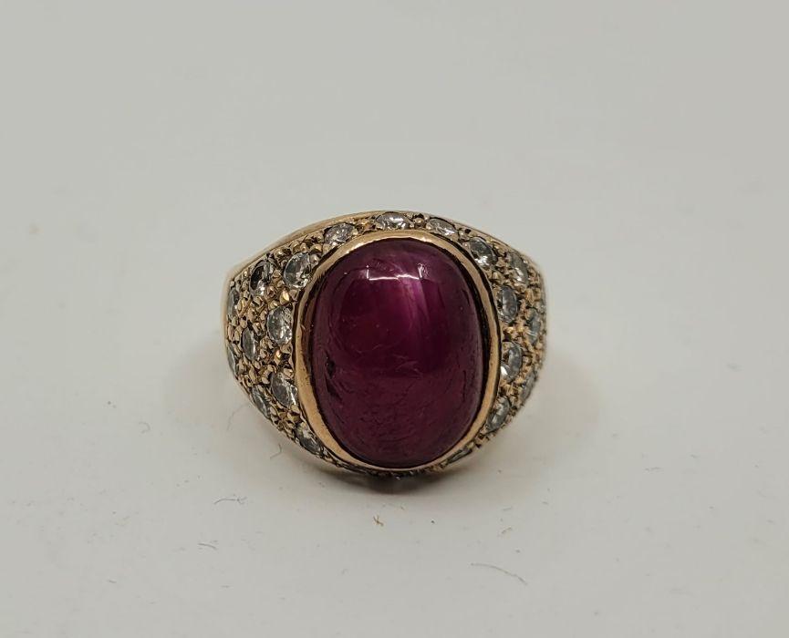 A gentleman's 9ct. gold, ruby and diamond ring, London 1988, having ...