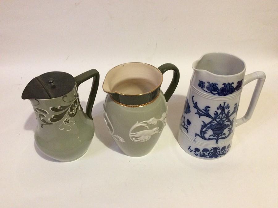 Three James Macintyre pottery jugs, early 20th Century, one tubelined ...