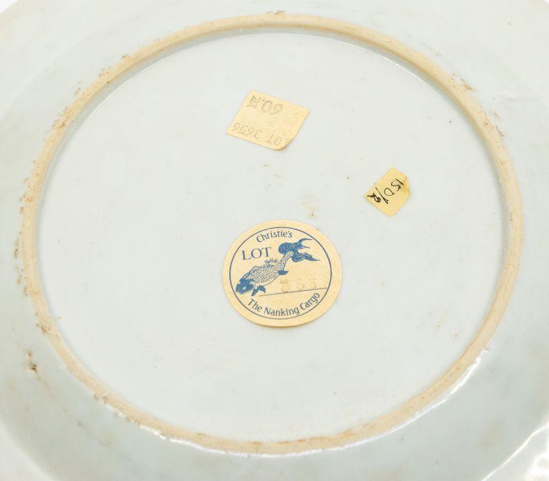 A Chinese Nanking blue and white plate, painted with flowering branches ...